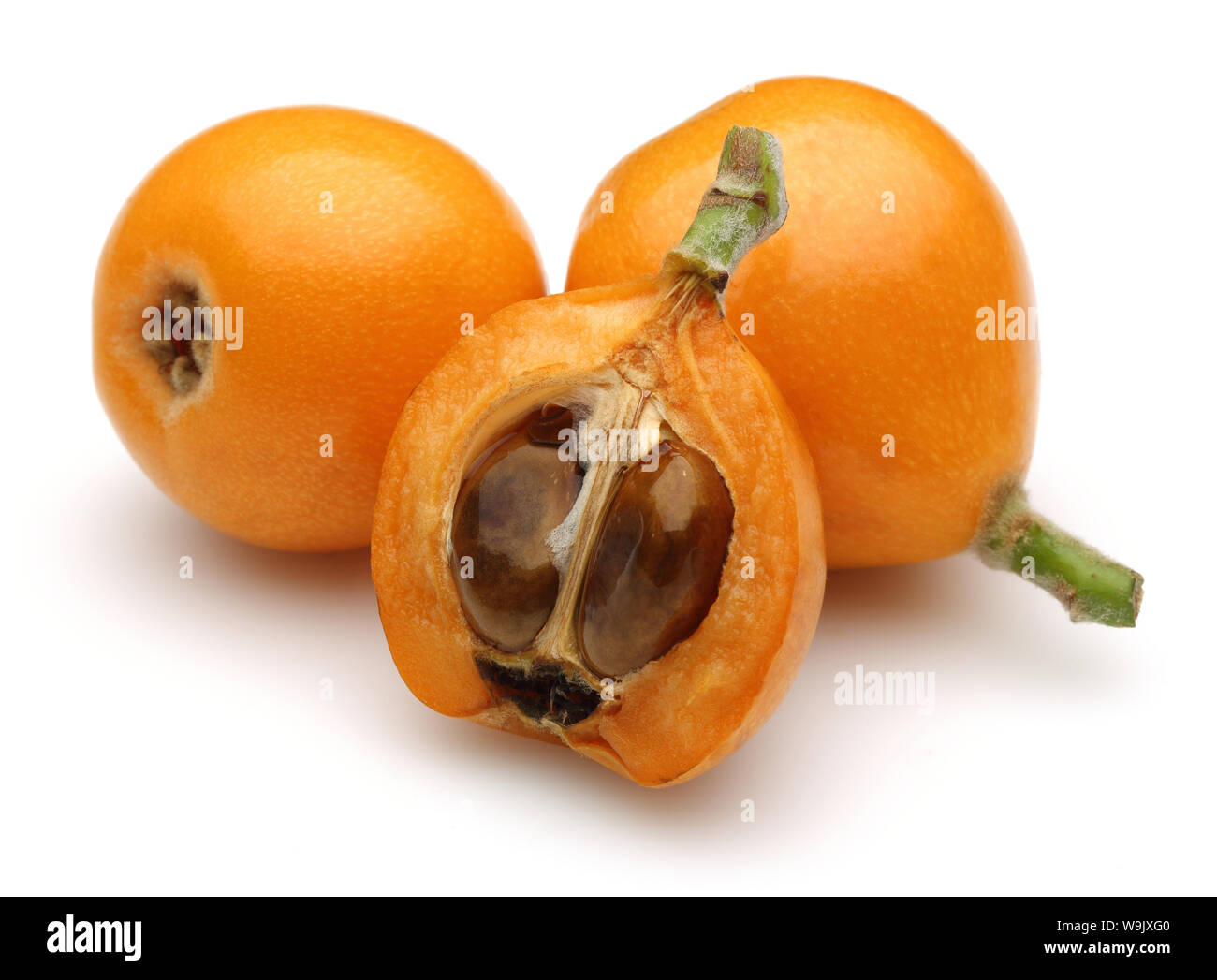 Half and whole ripe loquat fruits isolated on white background Stock ...