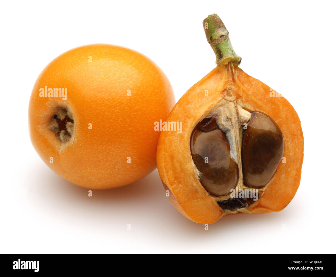 Half and whole ripe loquat fruits isolated on white background Stock ...