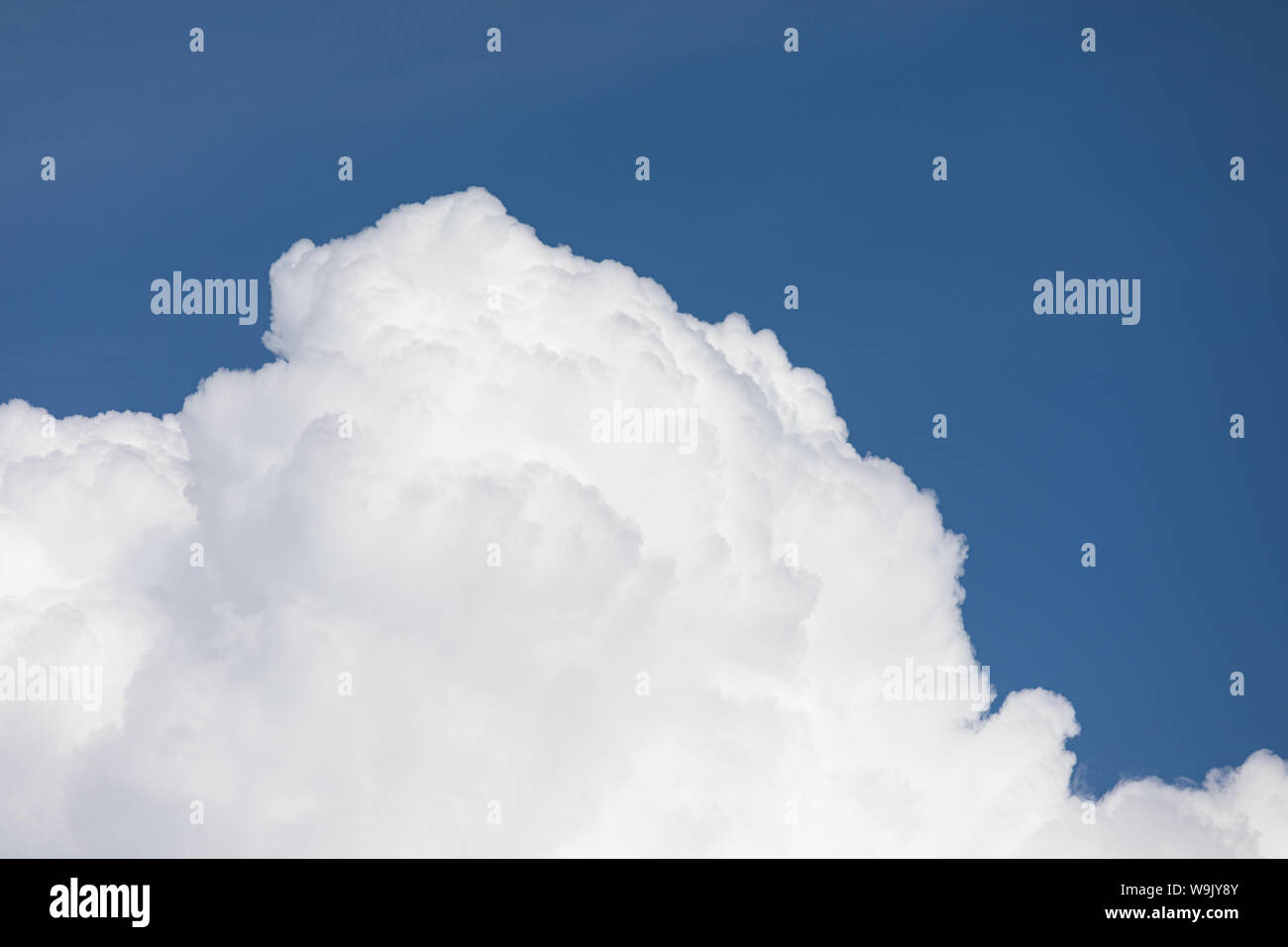 Fluffy cloud edge and blue sky Stock Photo - Alamy