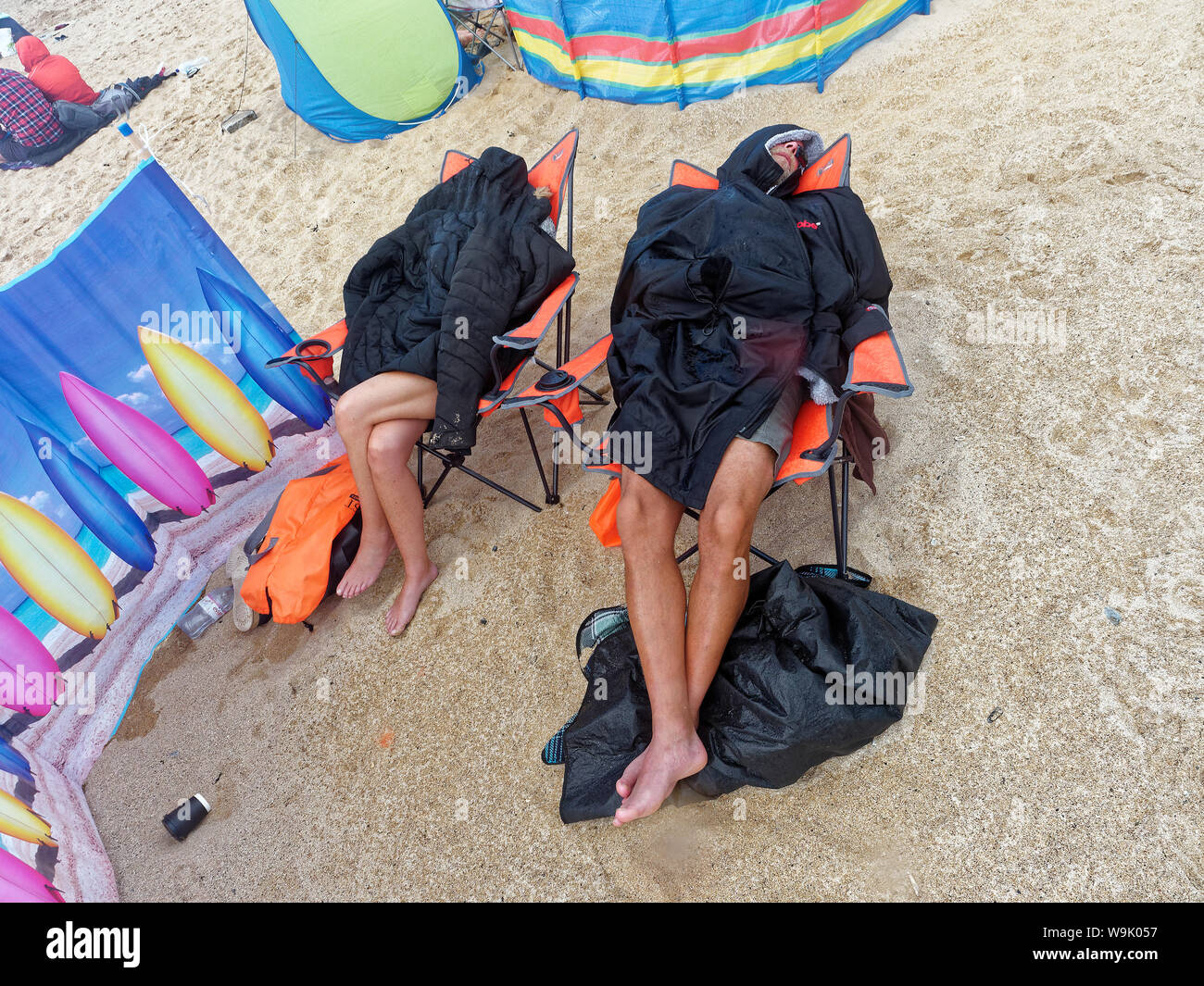 Keeping wrapped on a cold beach hi-res stock photography and images - Alamy