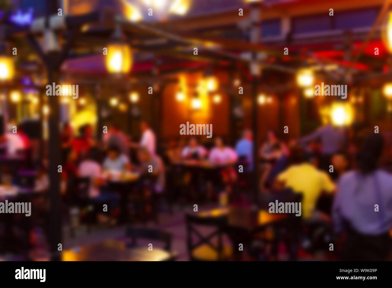 blurred image Lots of people enjoy at the bar pub fun of night festival ...