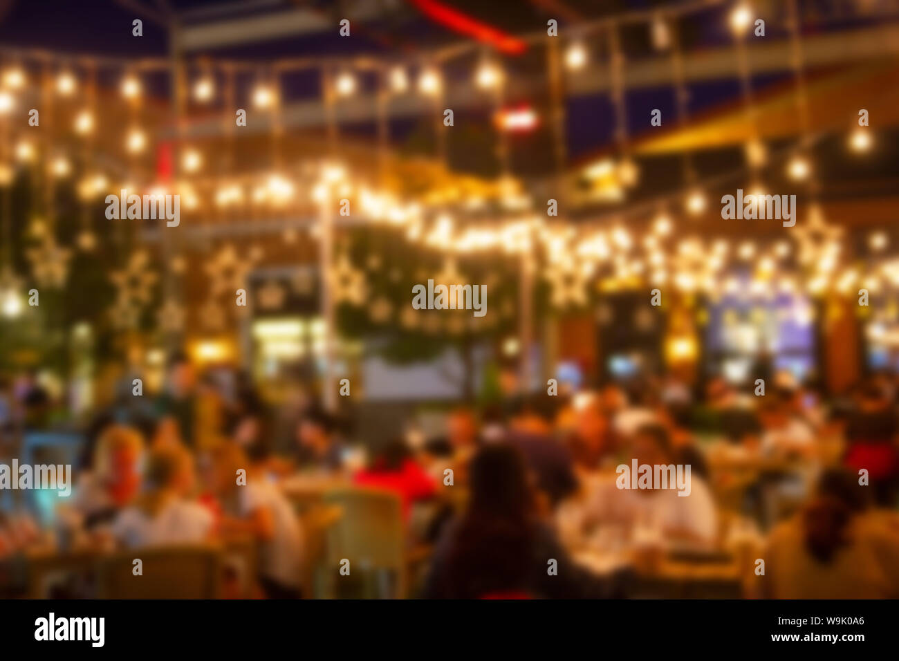 blurred image Lots of people enjoy at the bar pub fun of night festival ...