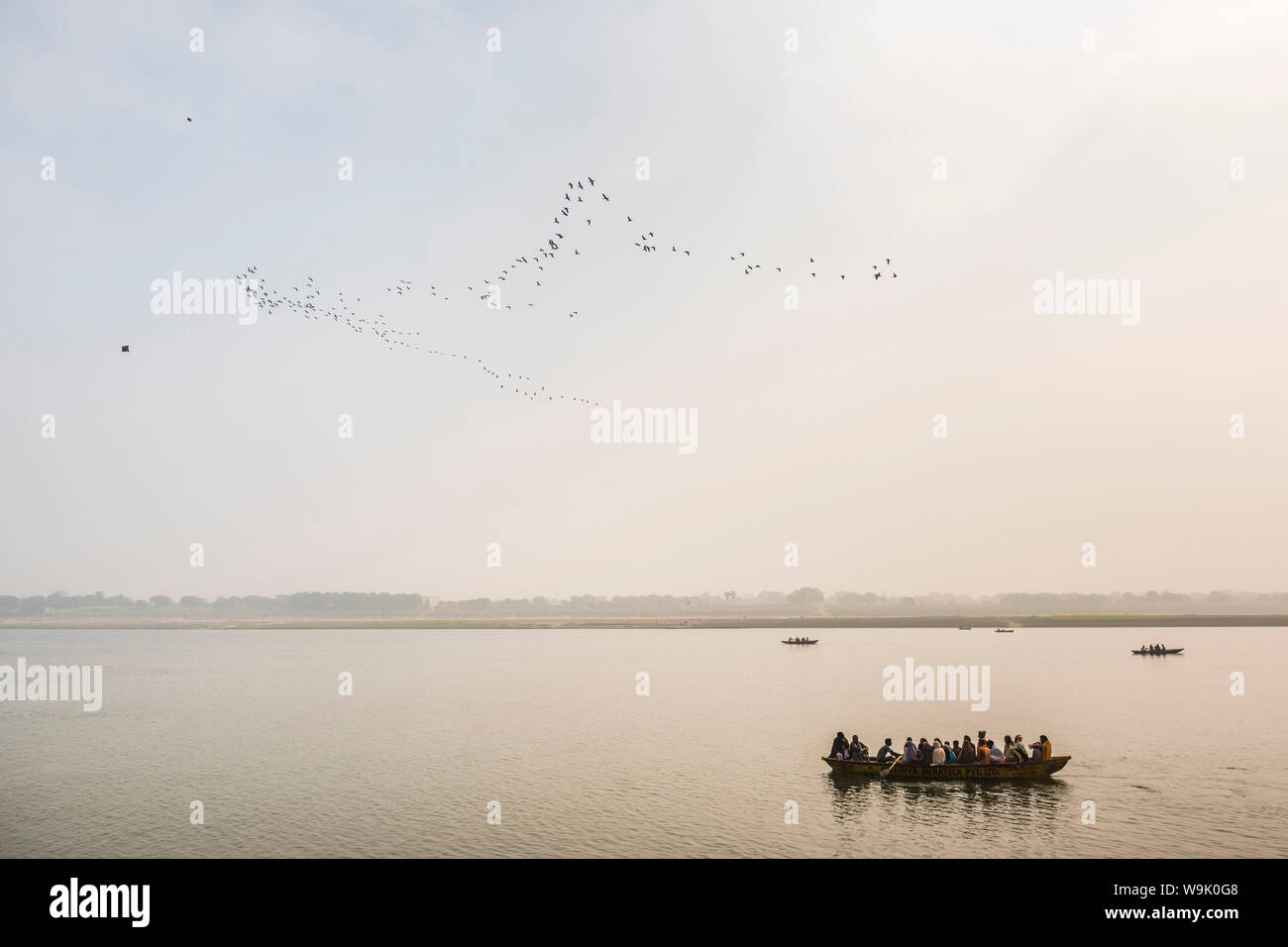 Pilgrims on a boat on the River Ganges, Varanasi, Uttar Pradesh, India ...