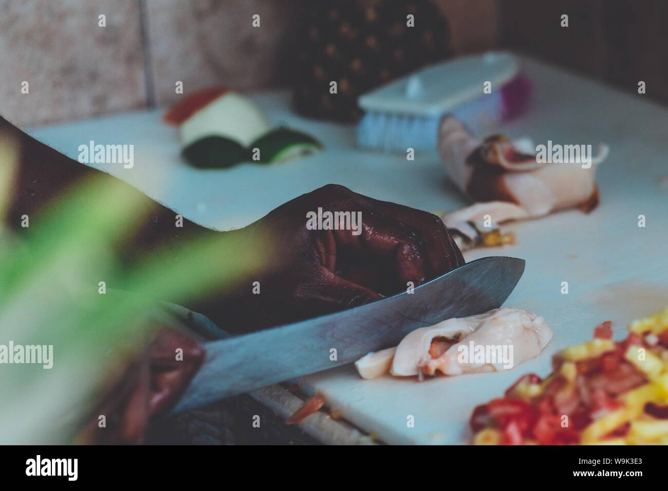 Closeup shot of an African male chopping meat Stock Photo - Alamy