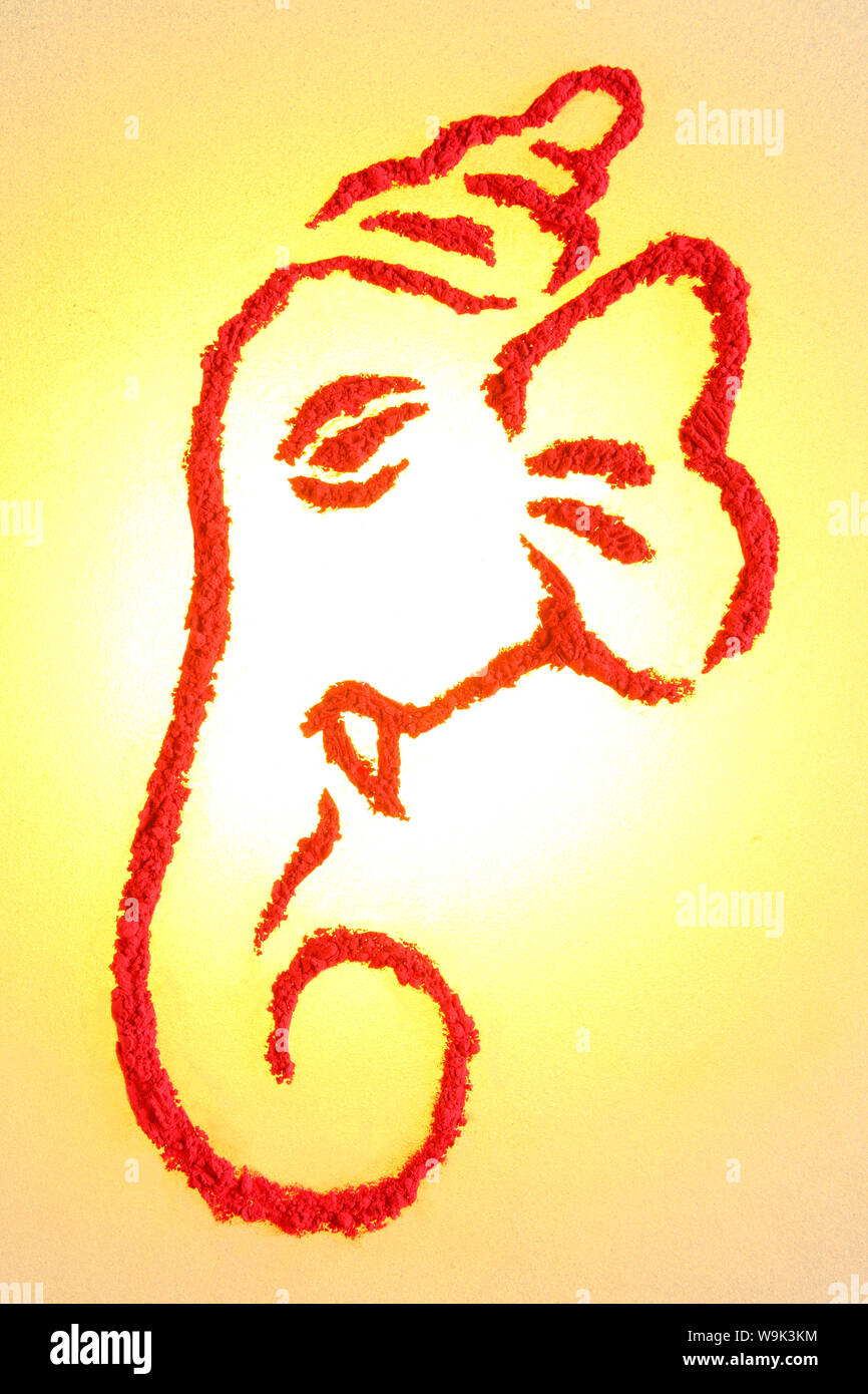 Ganesha symbol made of red powder color Stock Photo - Alamy