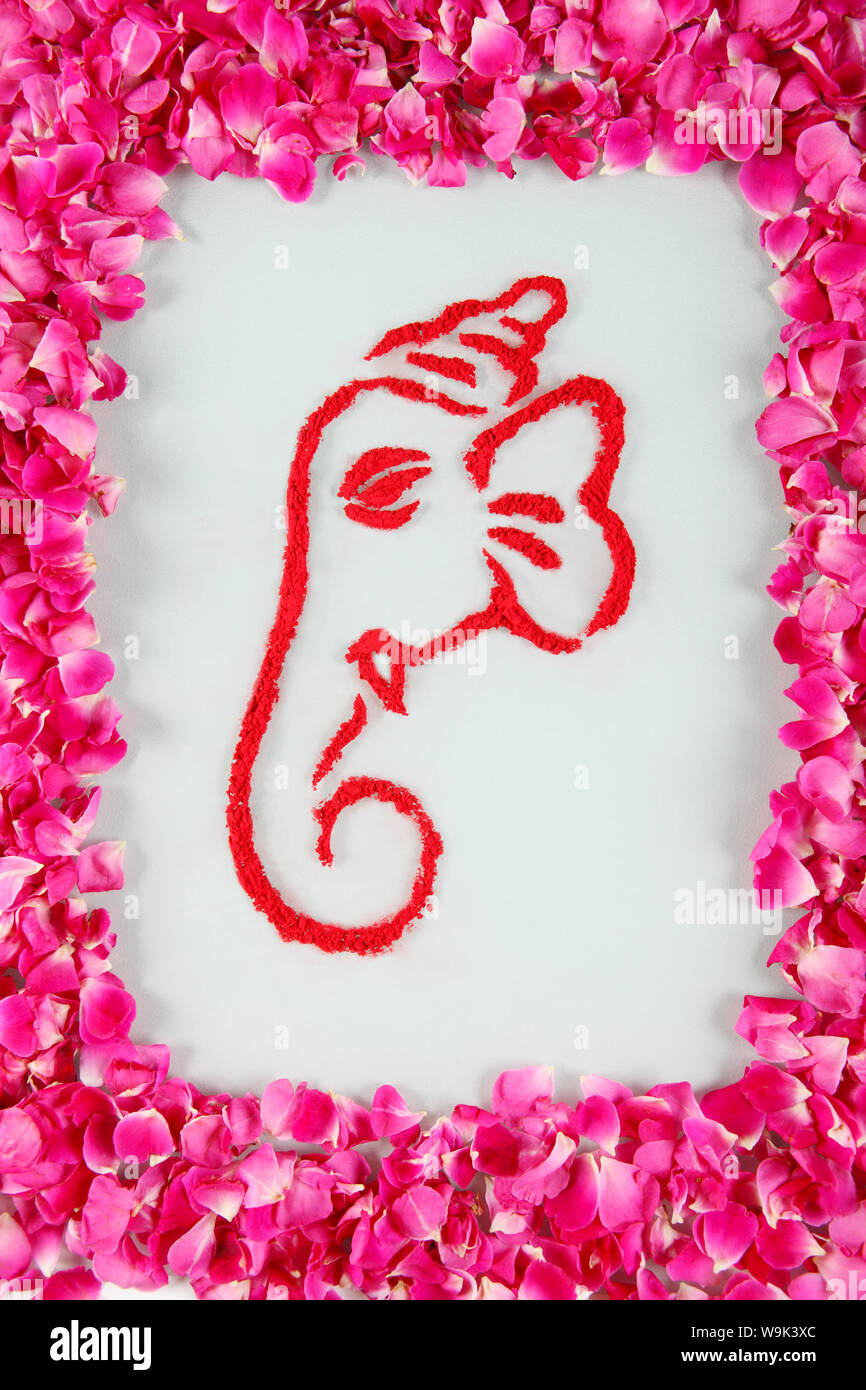 Ganesha symbol made of red powder color Stock Photo - Alamy