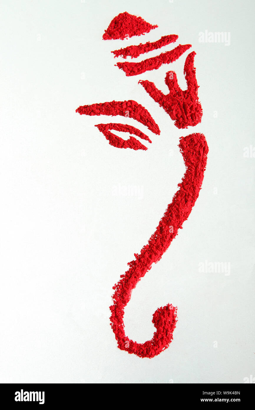 Ganesha symbol made of red powder color Stock Photo - Alamy