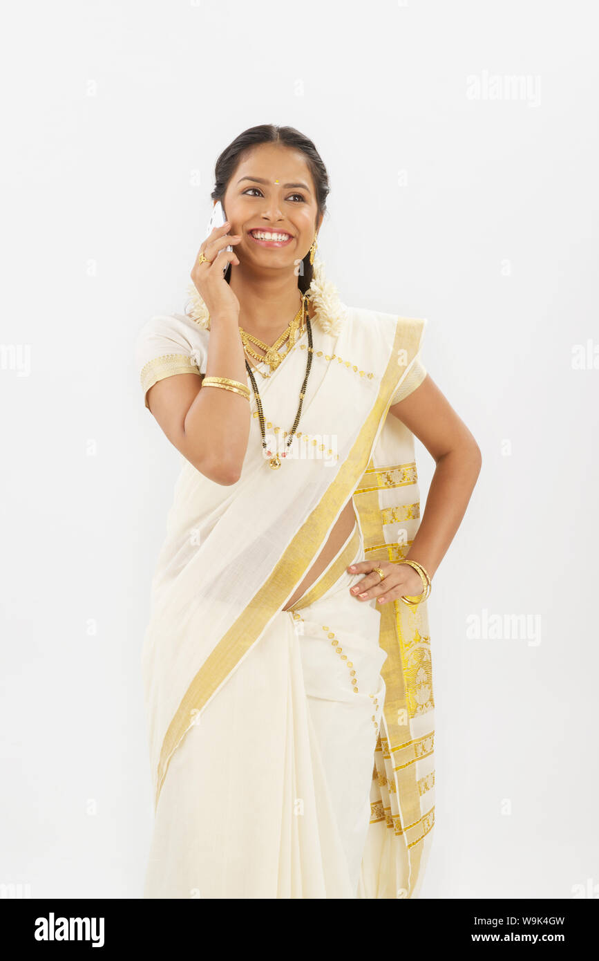 South Indian woman talking on a mobile phone Stock Photo - Alamy