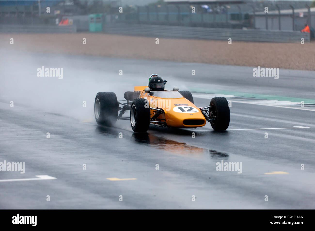 Stephen Weller driving his 1968, Elfin 600B, in the rain, during the ...
