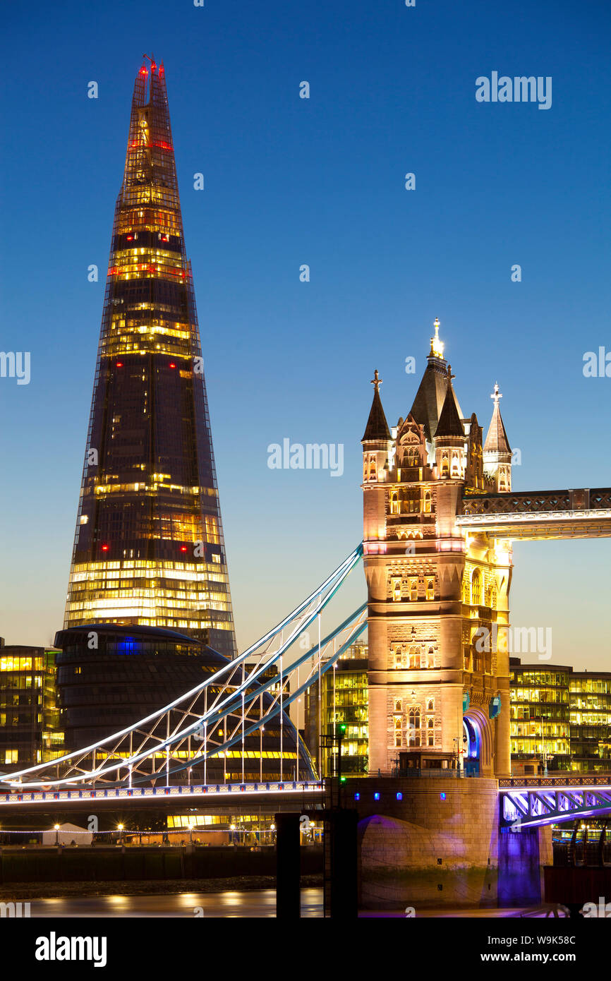 The Shard building and Tower Bridge at Night, London, United Kingdom ...