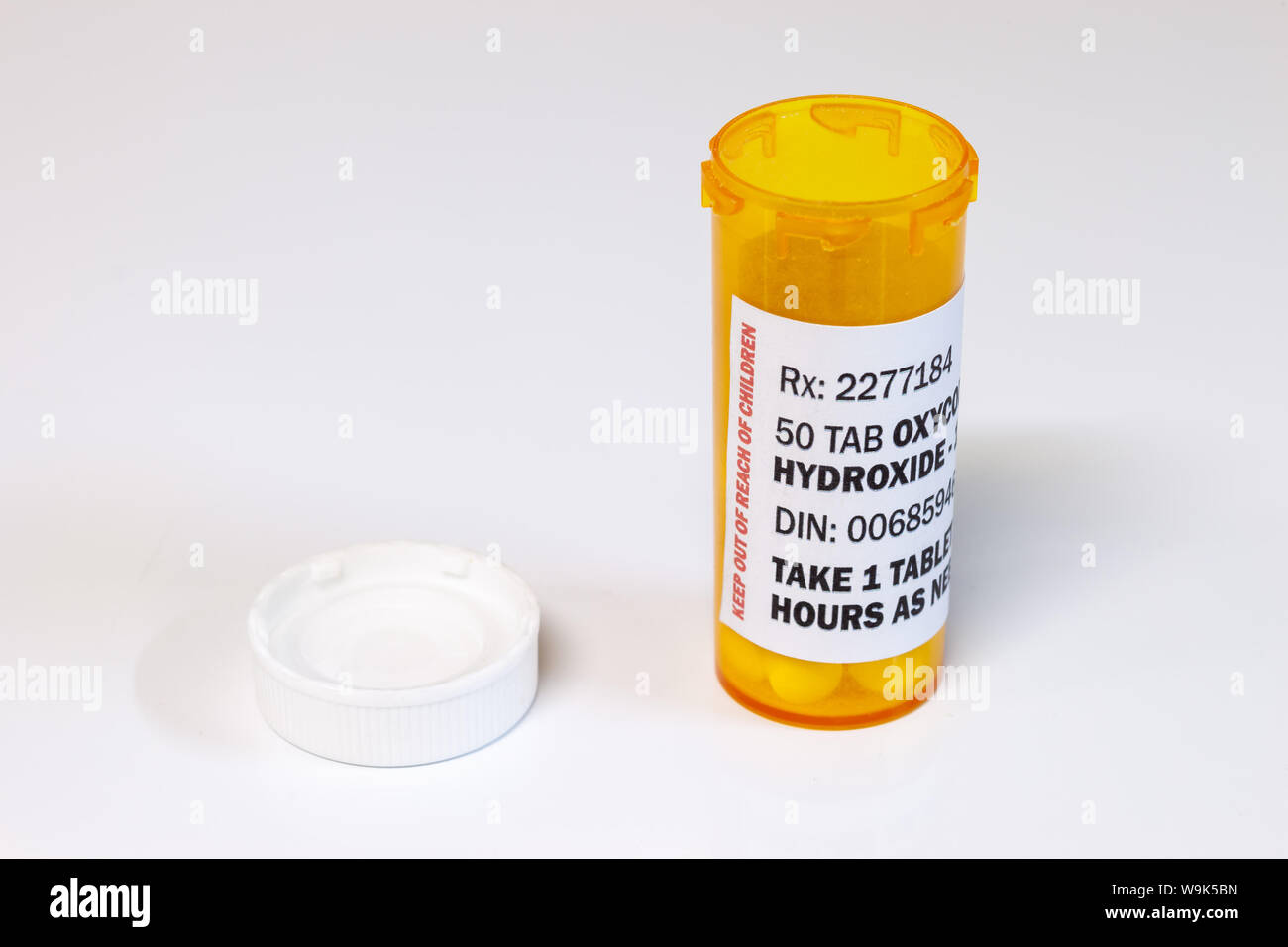 Prescription bottle with Oxycodone tablets isolated on a white ...