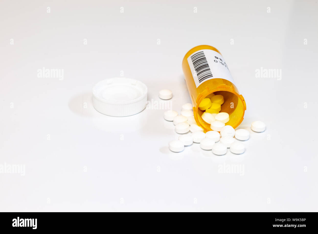 Prescription drug bottle with generic tablets or pills isolated on a ...