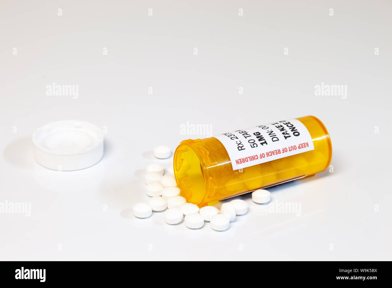 Prescription drug bottle with generic tablets or pills isolated on a ...