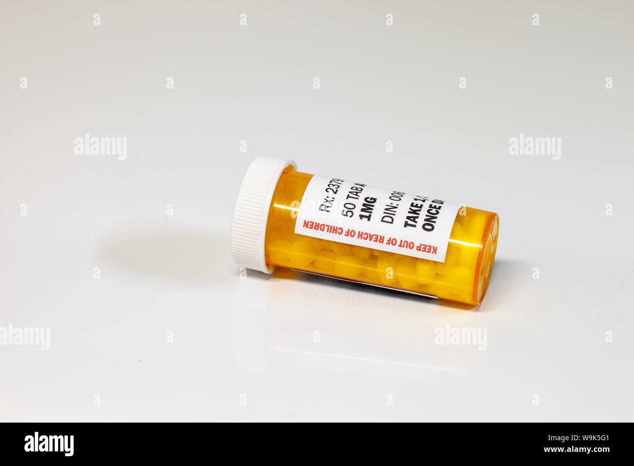 Prescription drug bottle with generic tablets or pills isolated on a ...