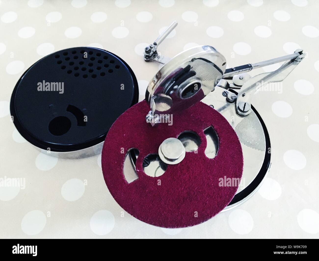 Closeup shot of a pocket phonograph on a light dotted background Stock ...