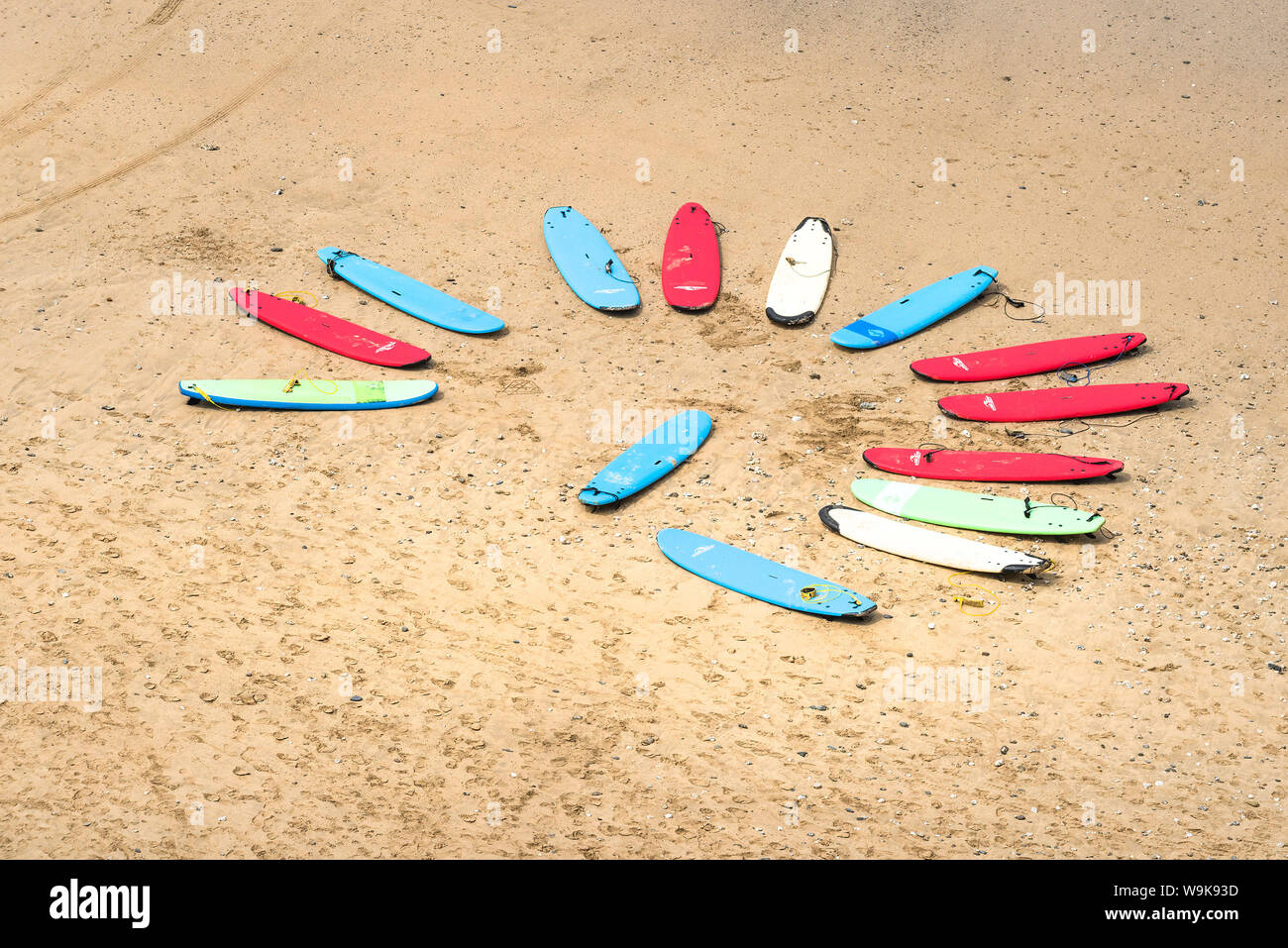 Coloured surfboards on a beach in Newquay in Cornwall Stock Photo - Alamy