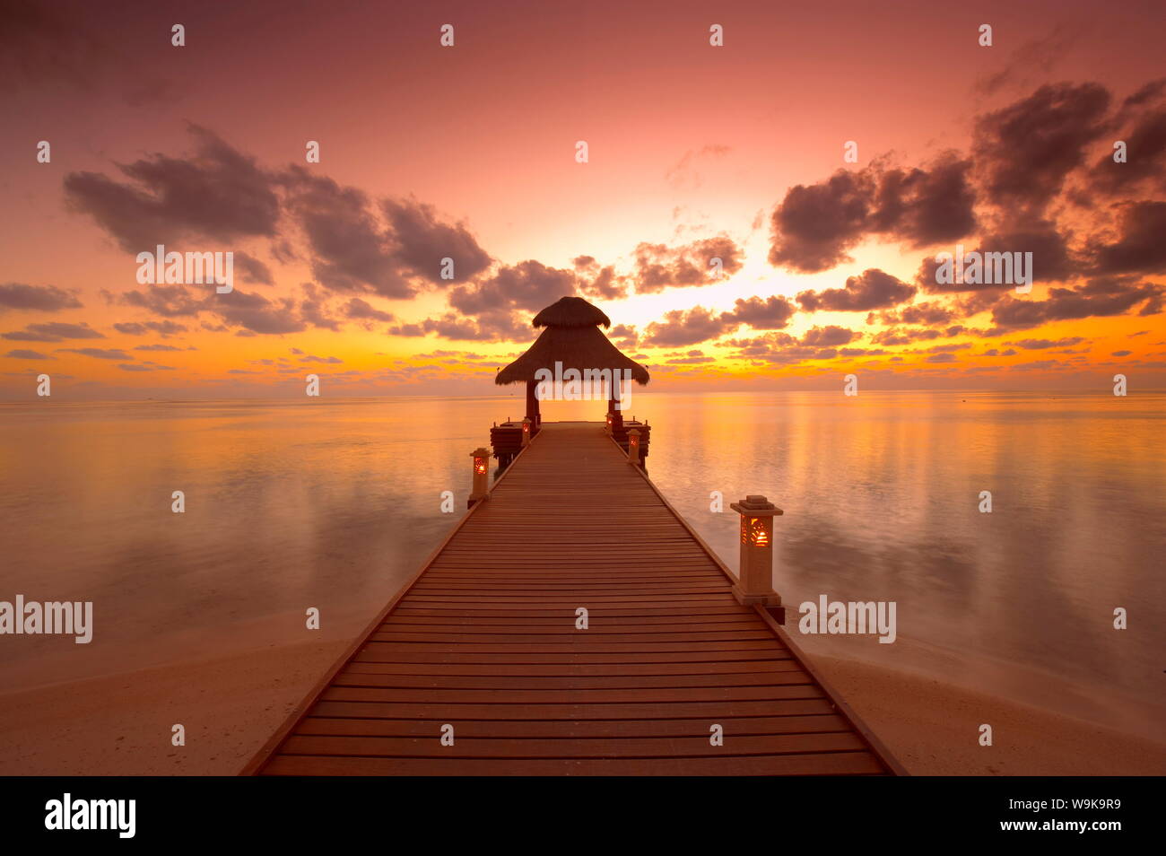 Jetty at sunset, island on North Male Atoll, Maldives, Indian Ocean ...