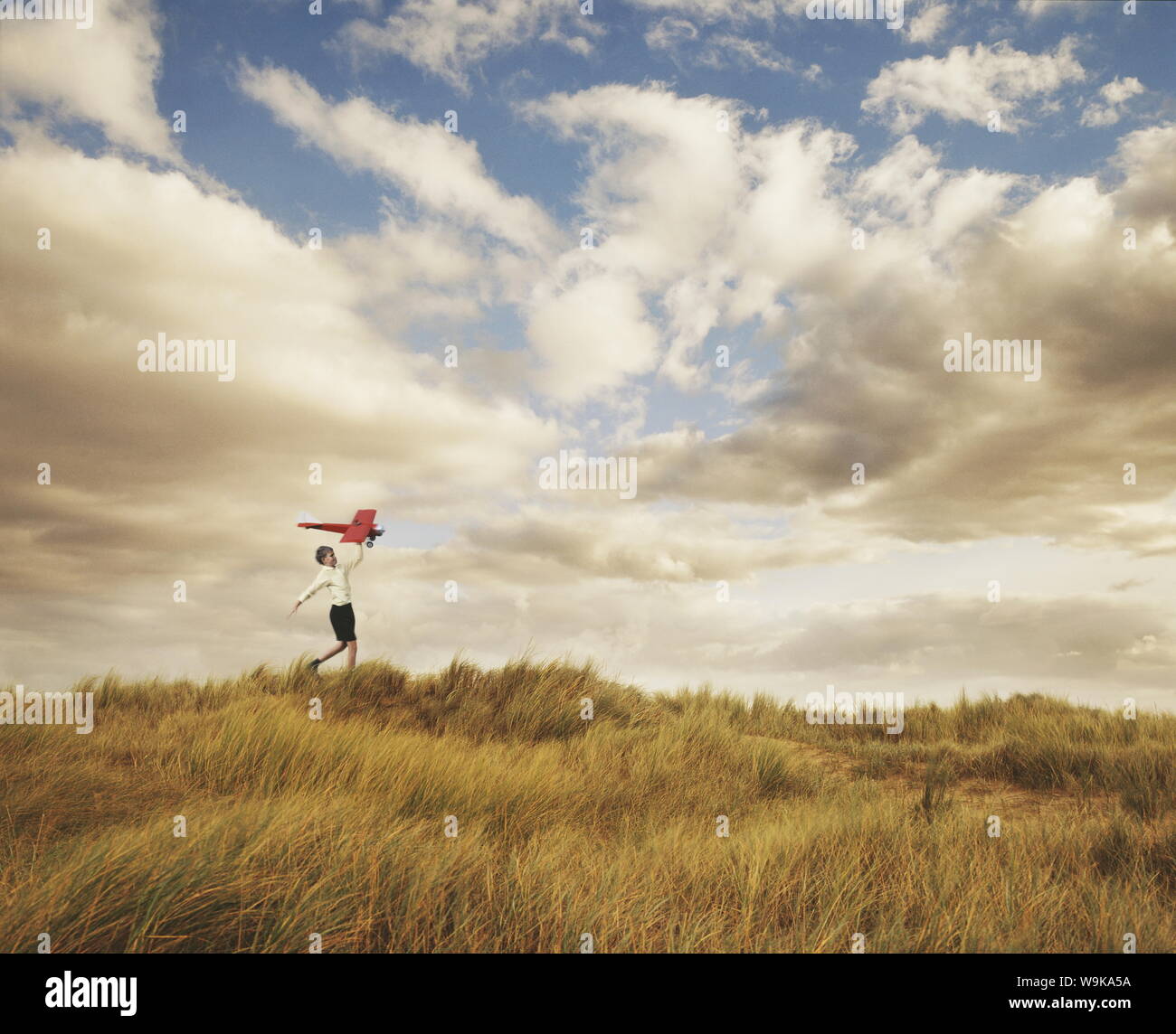 Little boy playing with model plane Stock Photo - Alamy