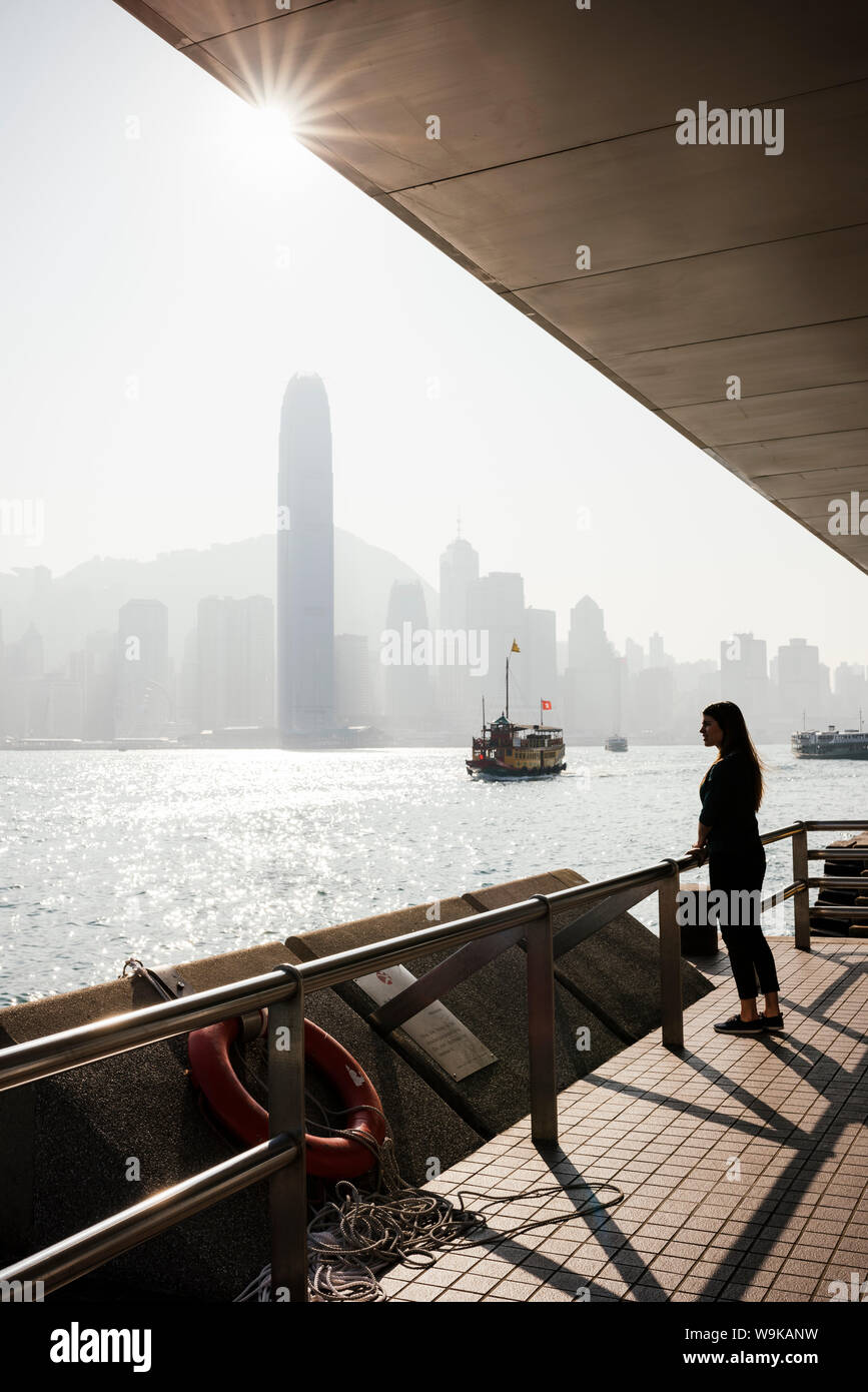 Young woman standing on Tsim Sha Tsui Waterfront, Kowloon, Hong Kong, China, Asia Stock Photo ...