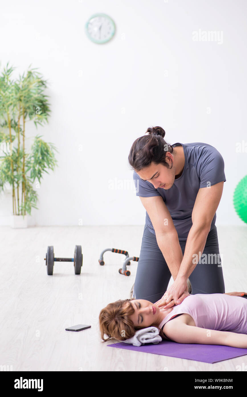 The young woman feeling bad during training in first aid concept Stock ...