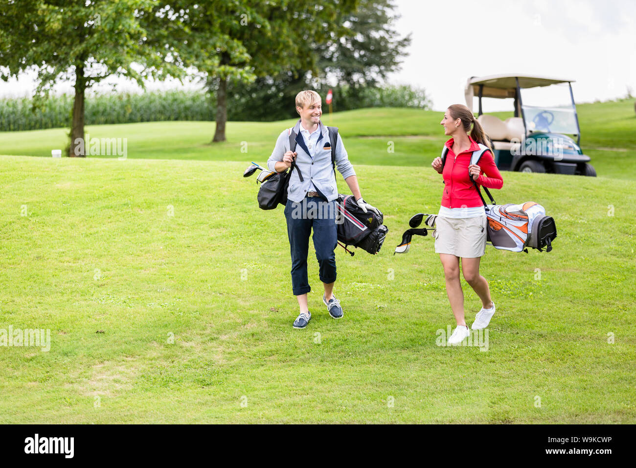 Carrying golf bags hi-res stock photography and images - Alamy