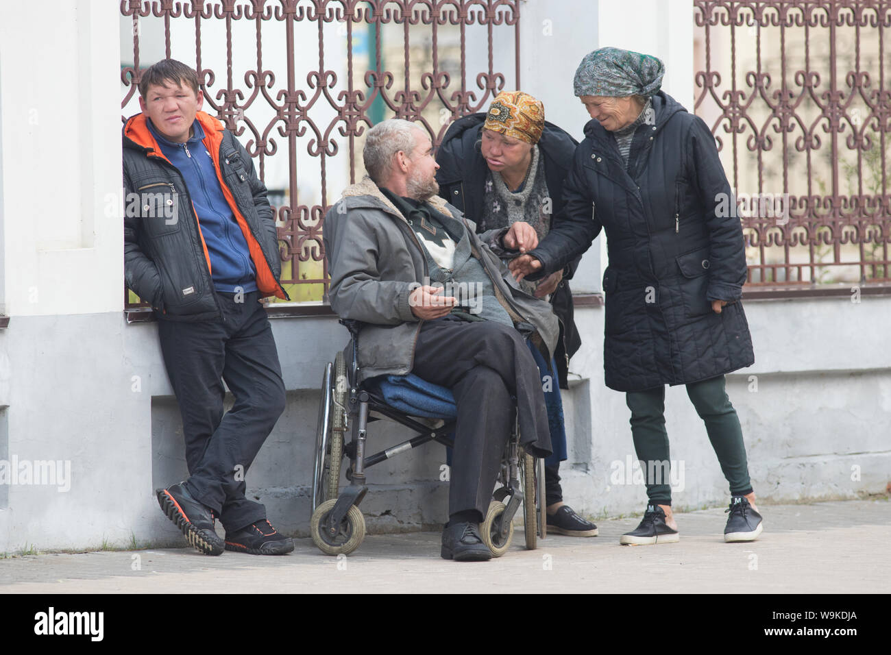 RUSSIA, KAZAN 09-08-2019: disabled man talking with homeless people ...