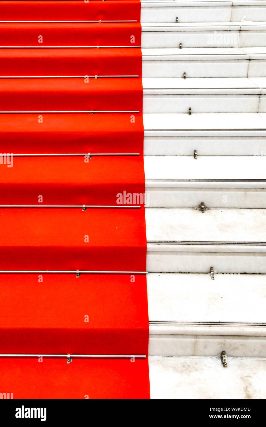 CANNES, FRANCE - APRIL 2019: Red carpet over white steps in readiness ...