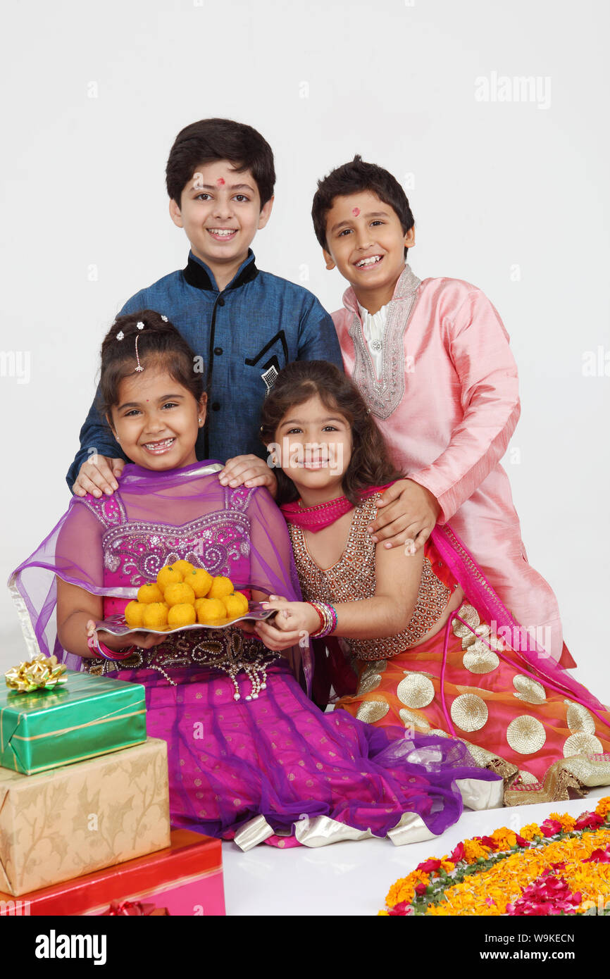 Group of children celebrating Diwali and smiling Stock Photo - Alamy