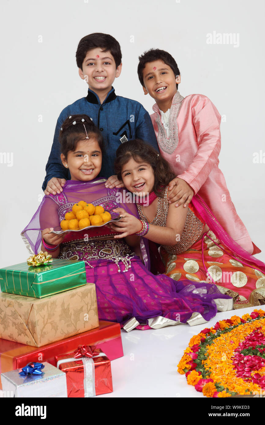 Group of children celebrating Diwali and smiling Stock Photo - Alamy