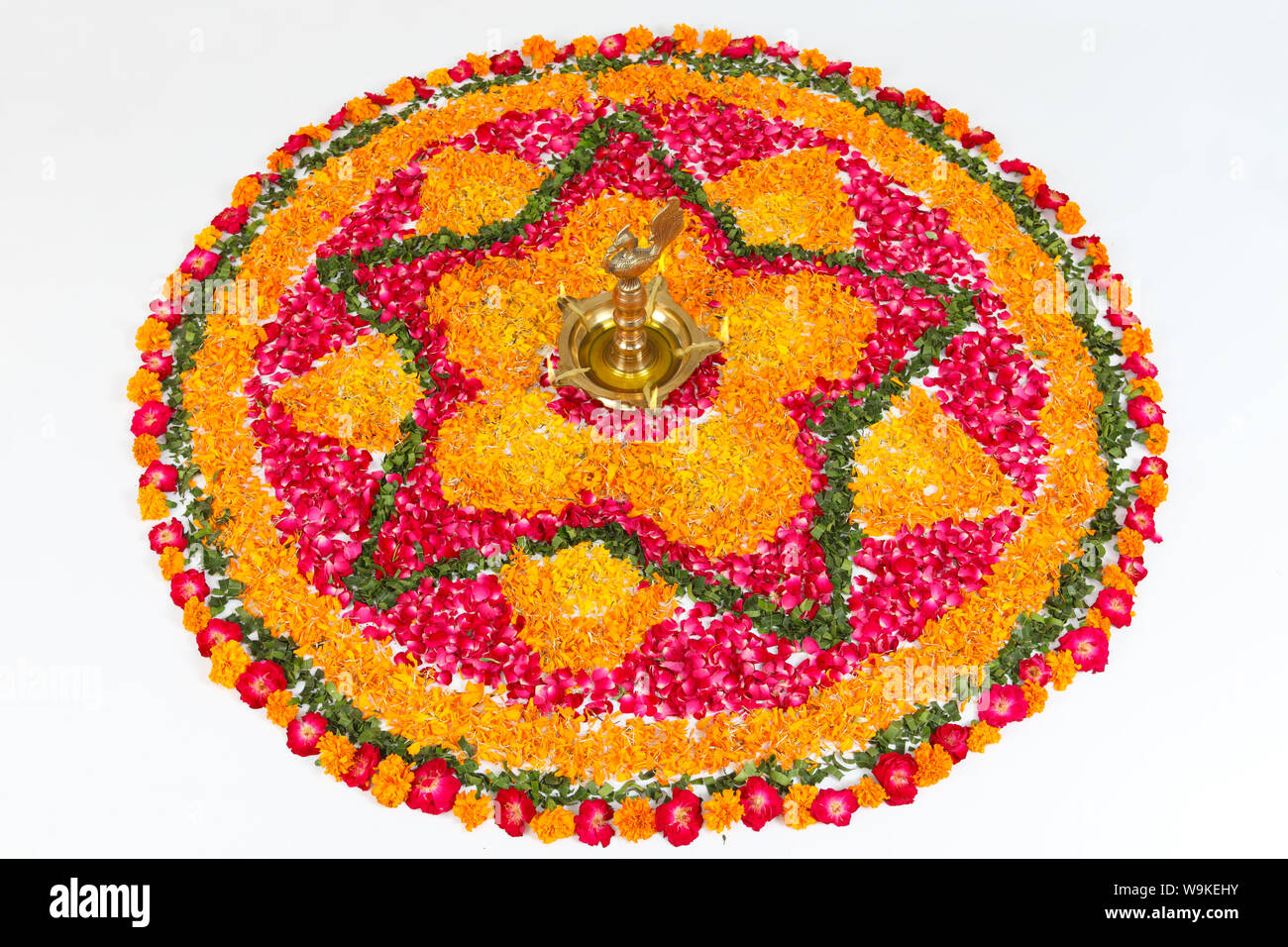 Colorful rangoli on the floor Stock Photo - Alamy