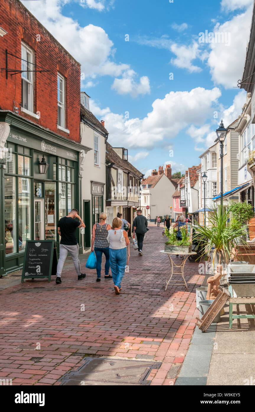 People walking down West Street in Faversham on a sunny summers day ...