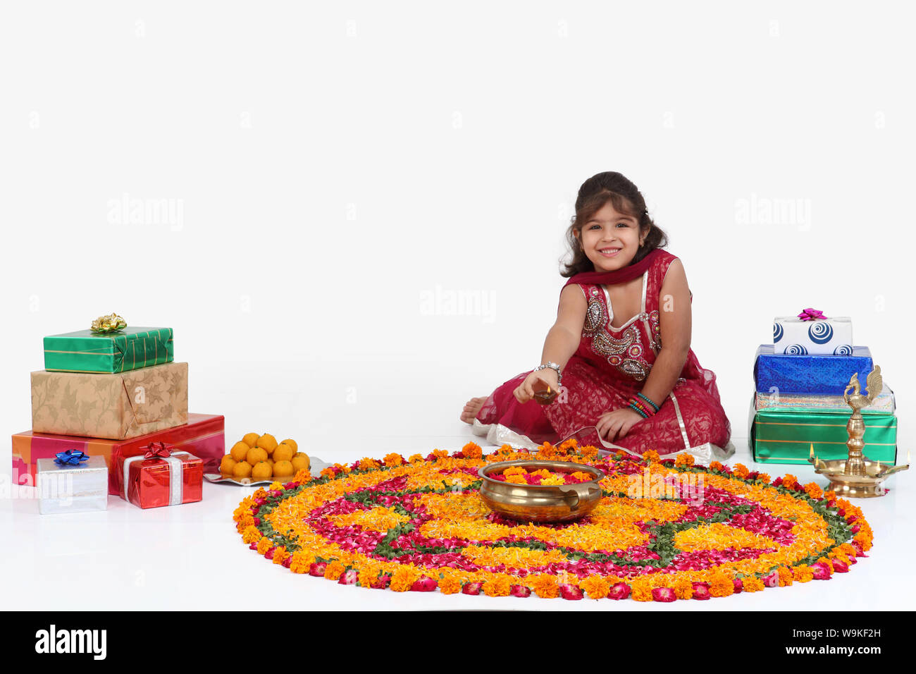 Girl making rangoli Stock Photo - Alamy