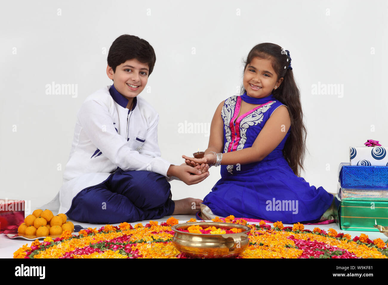 Two children celebrating Diwali Stock Photo - Alamy