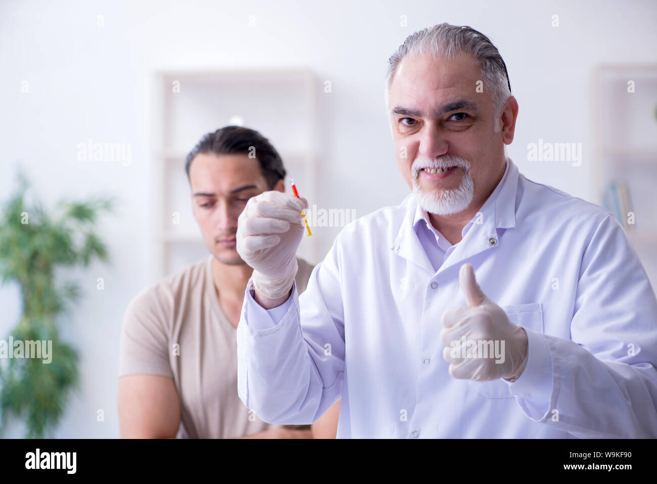 The male patient visitng doctor for shot inoculation Stock Photo - Alamy