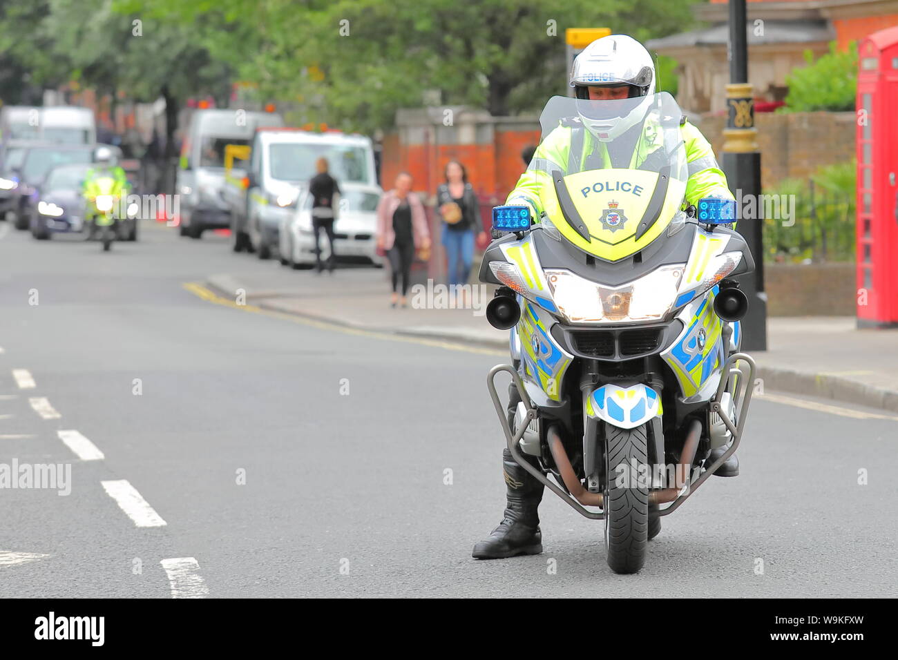 Police officer ride motorbike in downtown London UK Stock Photo - Alamy