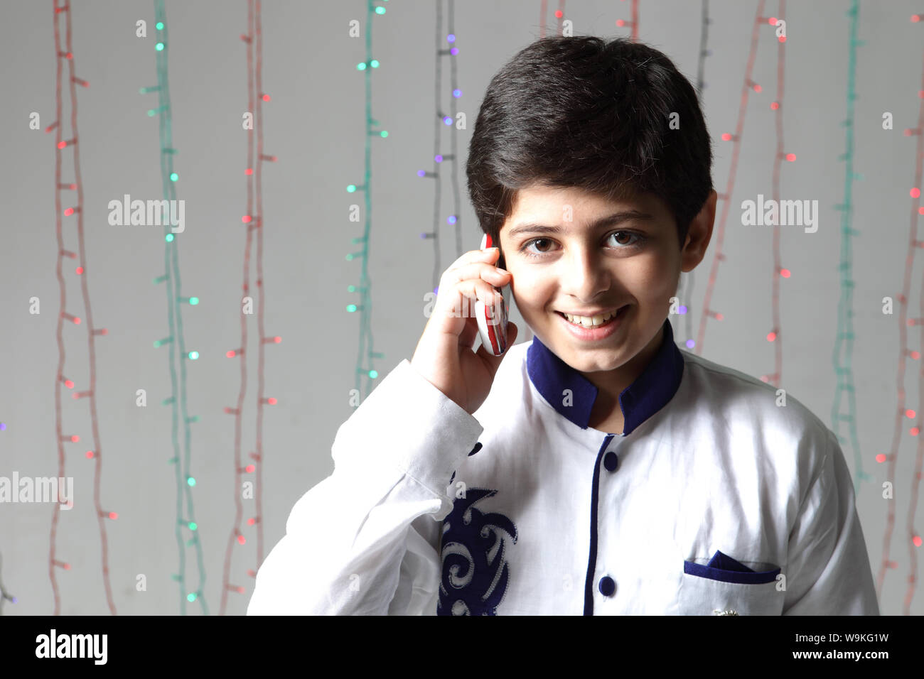 Boy talking on a mobile phone Stock Photo - Alamy