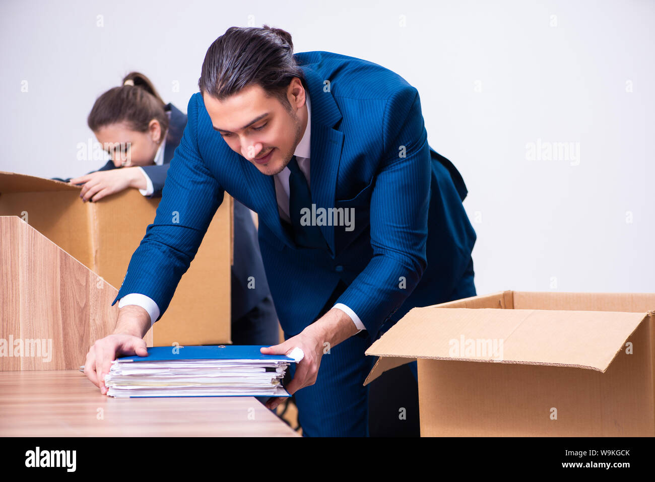 The two employees being fired from their work Stock Photo - Alamy
