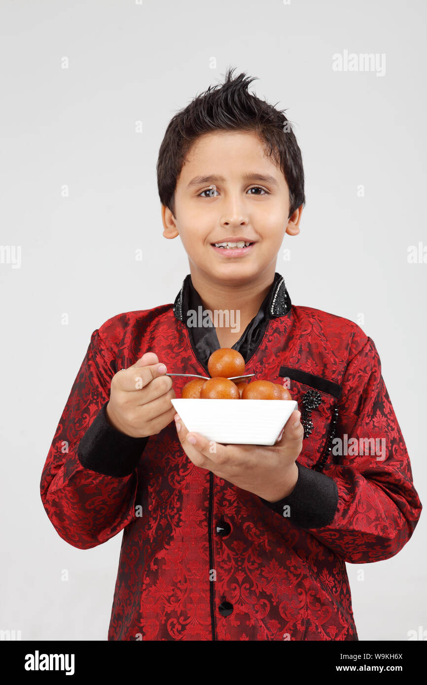 Gulab jamun with spoon hi-res stock photography and images - Alamy