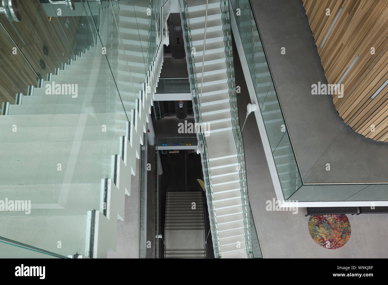 Main staircase seen from upper level of atrium, with poplar strip-clad ...