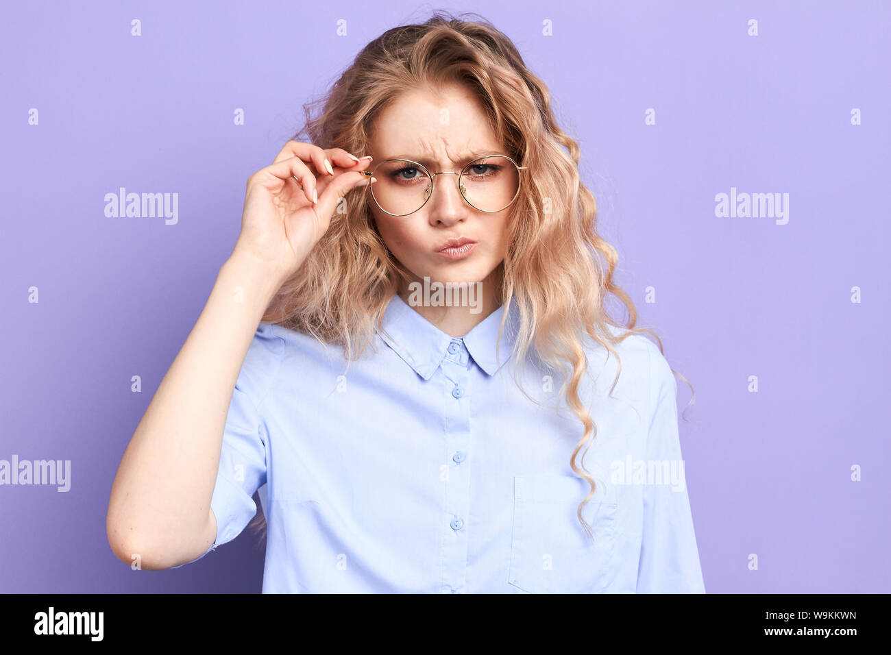 angry unhappy serious woman expresses doubt and suspicion, feeling ...