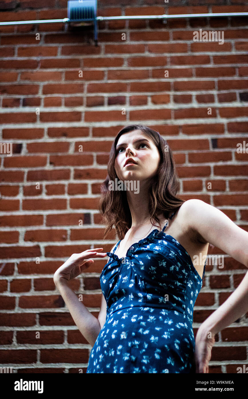 Model facing backwards against a tree Stock Photo - Alamy
