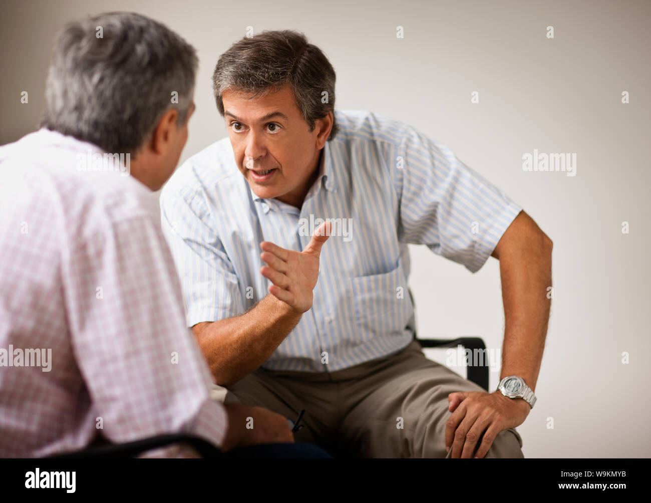 Businessmen having a disagreement Stock Photo - Alamy