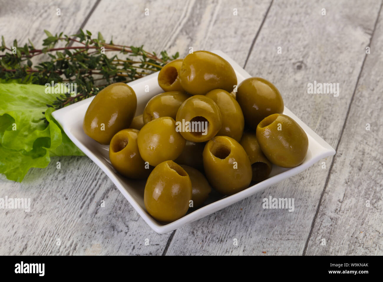 Big green olives in the bowl Stock Photo - Alamy