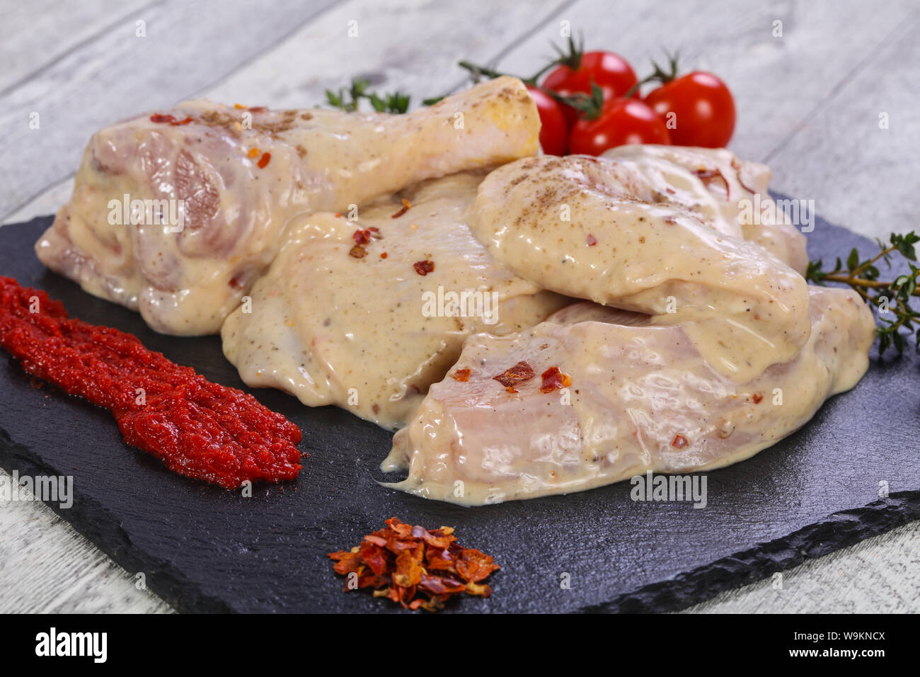 Marinated chicken parts ready for roast Stock Photo - Alamy