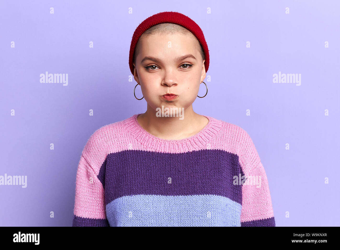 cheerful smiling teenager blowing cheeks. Human facial expressions ...