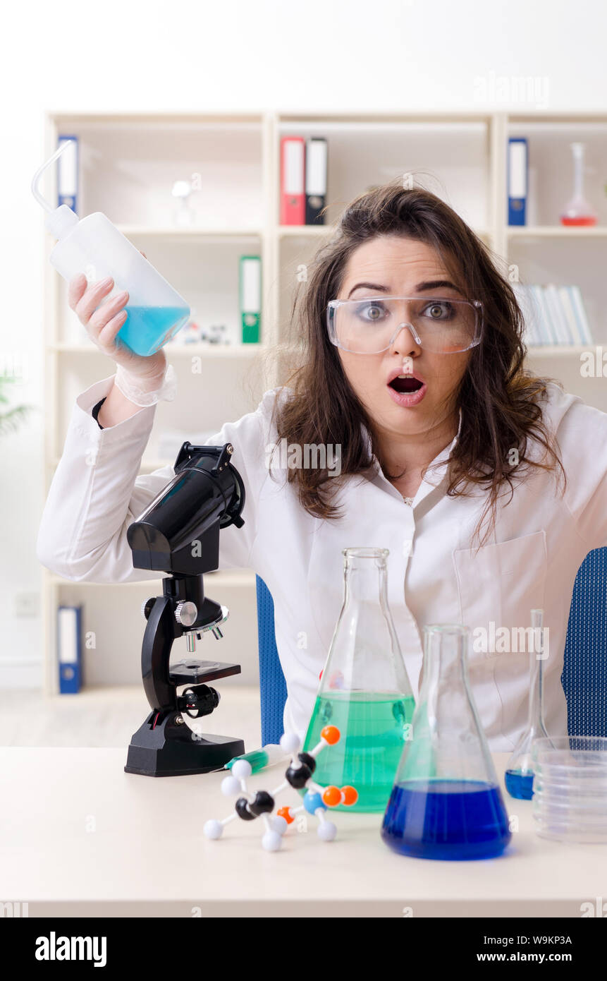 Funny female chemist working in the lab hi-res stock photography and ...