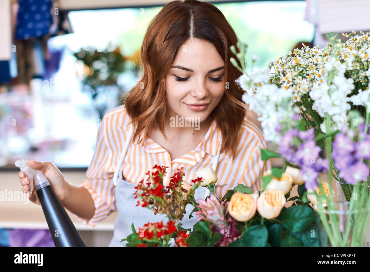 beautiful gorgeous girl enjoying the smell of flowers, wonderful aroma ...