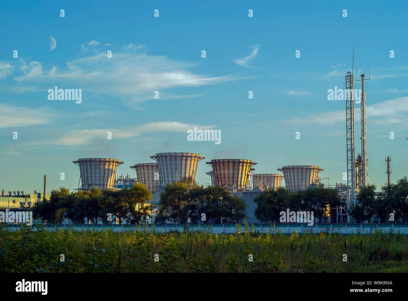 Industrial landscape with cooling towers on the greening territory of ...