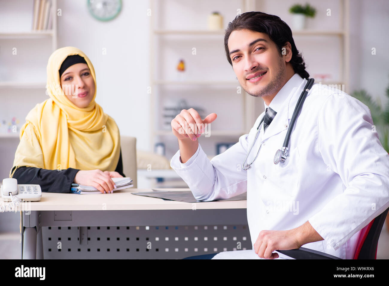 The female arab patient visiting male doctor Stock Photo - Alamy