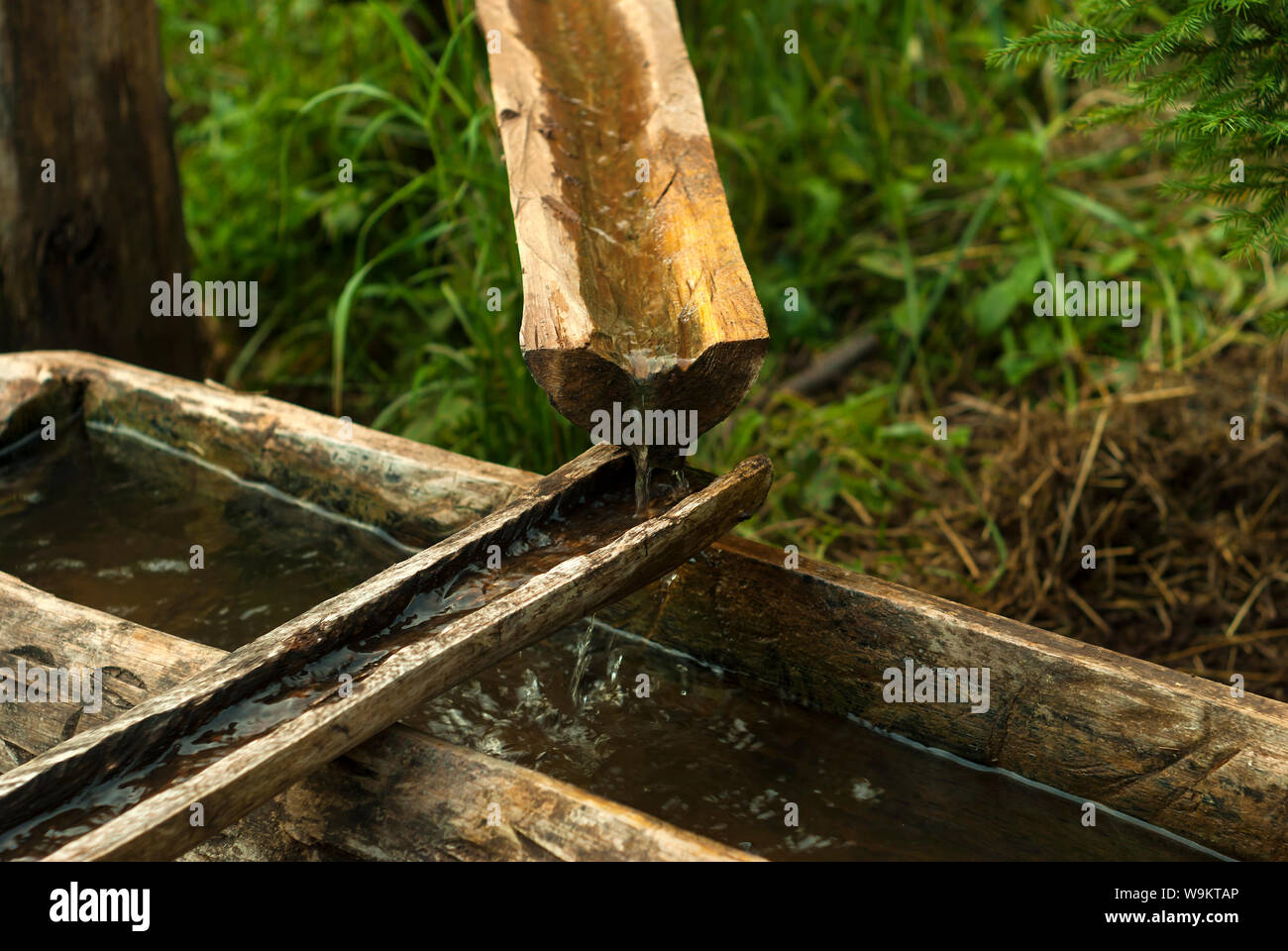 primitive water supply system from wooden gutters leading from the ...